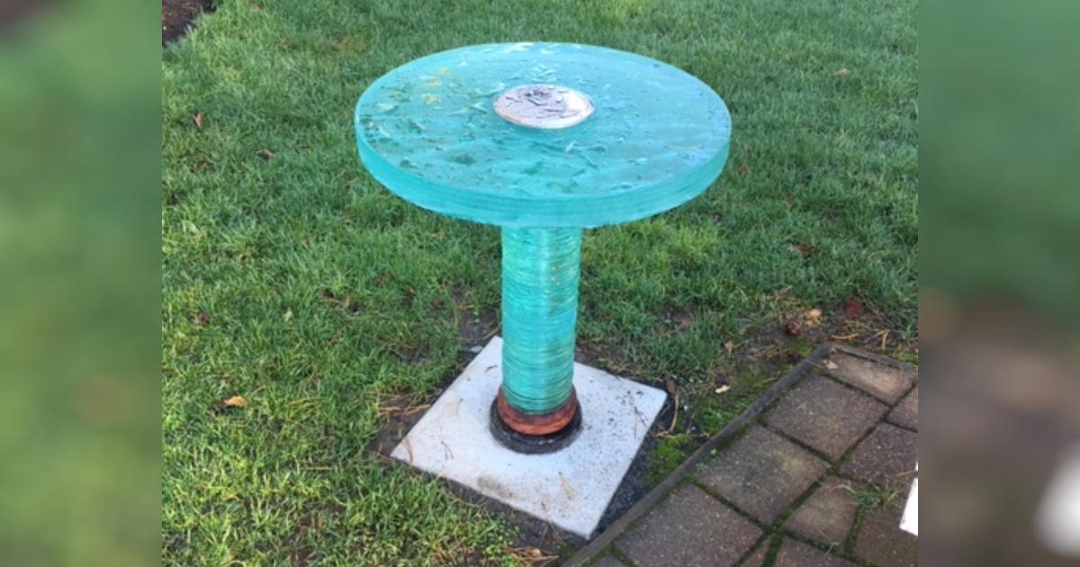 Vandalised commerorative glass table - Givealittle